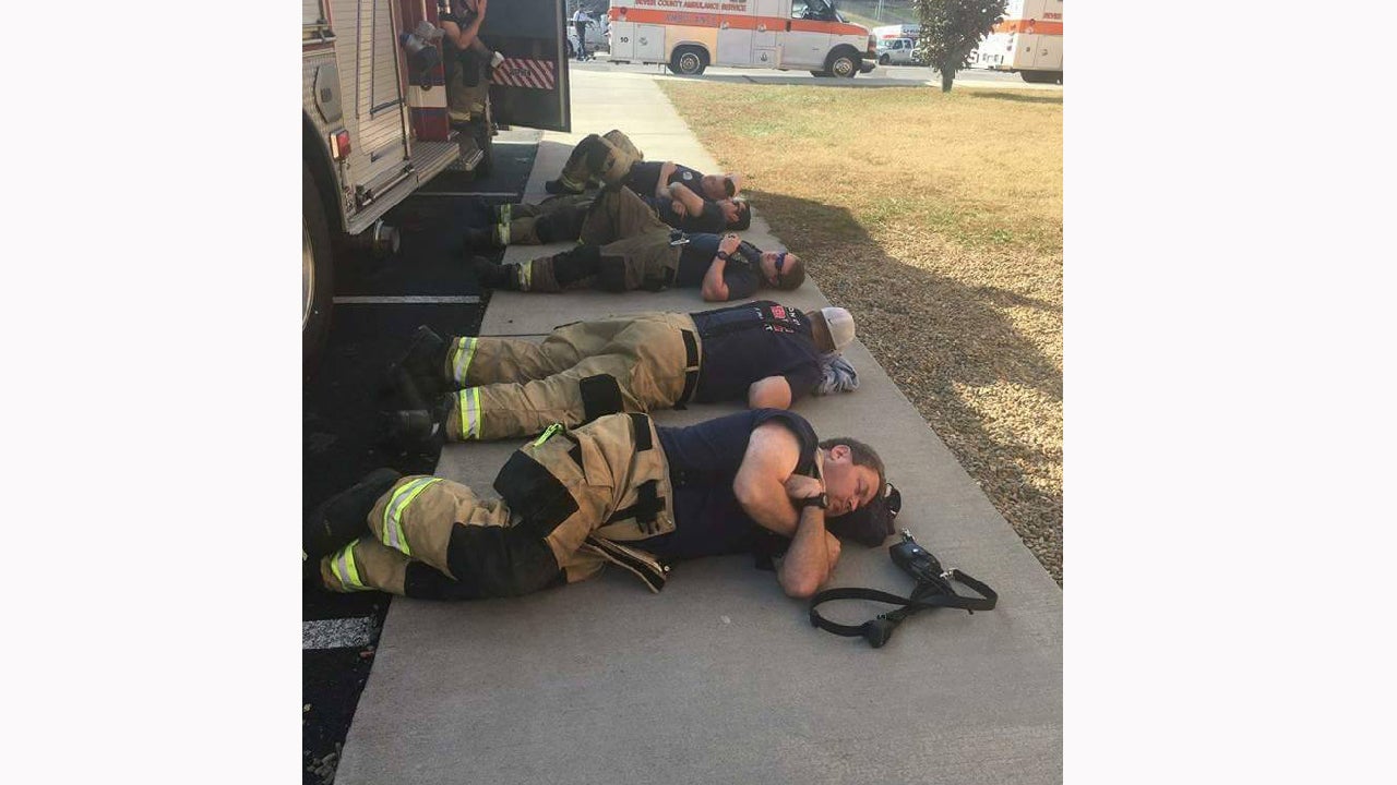Photo of Firefighters Sleeping on Ground Becomes Iconic Image of ...