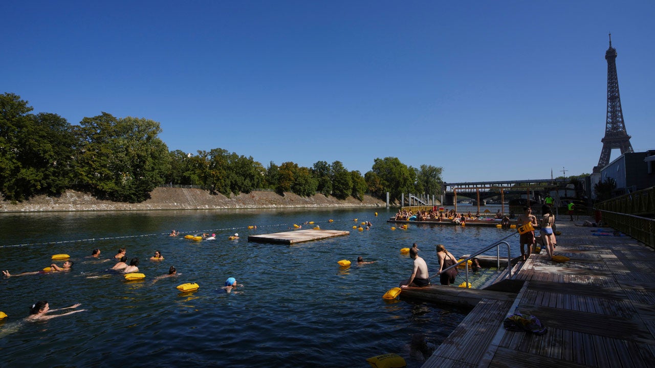 Seine River Greets Swimmers As Paris Stifles In Heat Wave | Weather.com