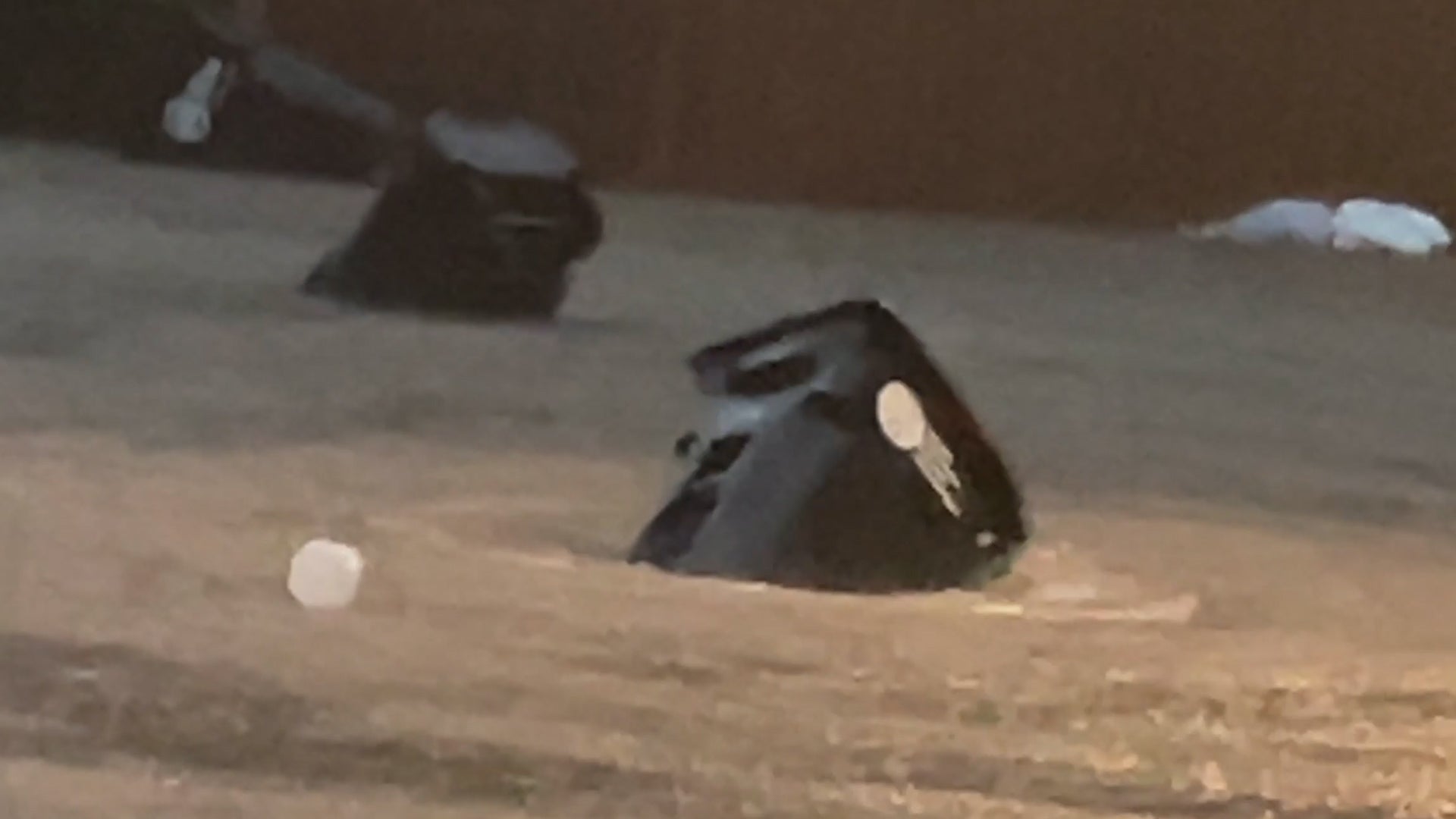 Watch: Floodwaters Twirl Trash Bin In Street - Videos from The Weather ...