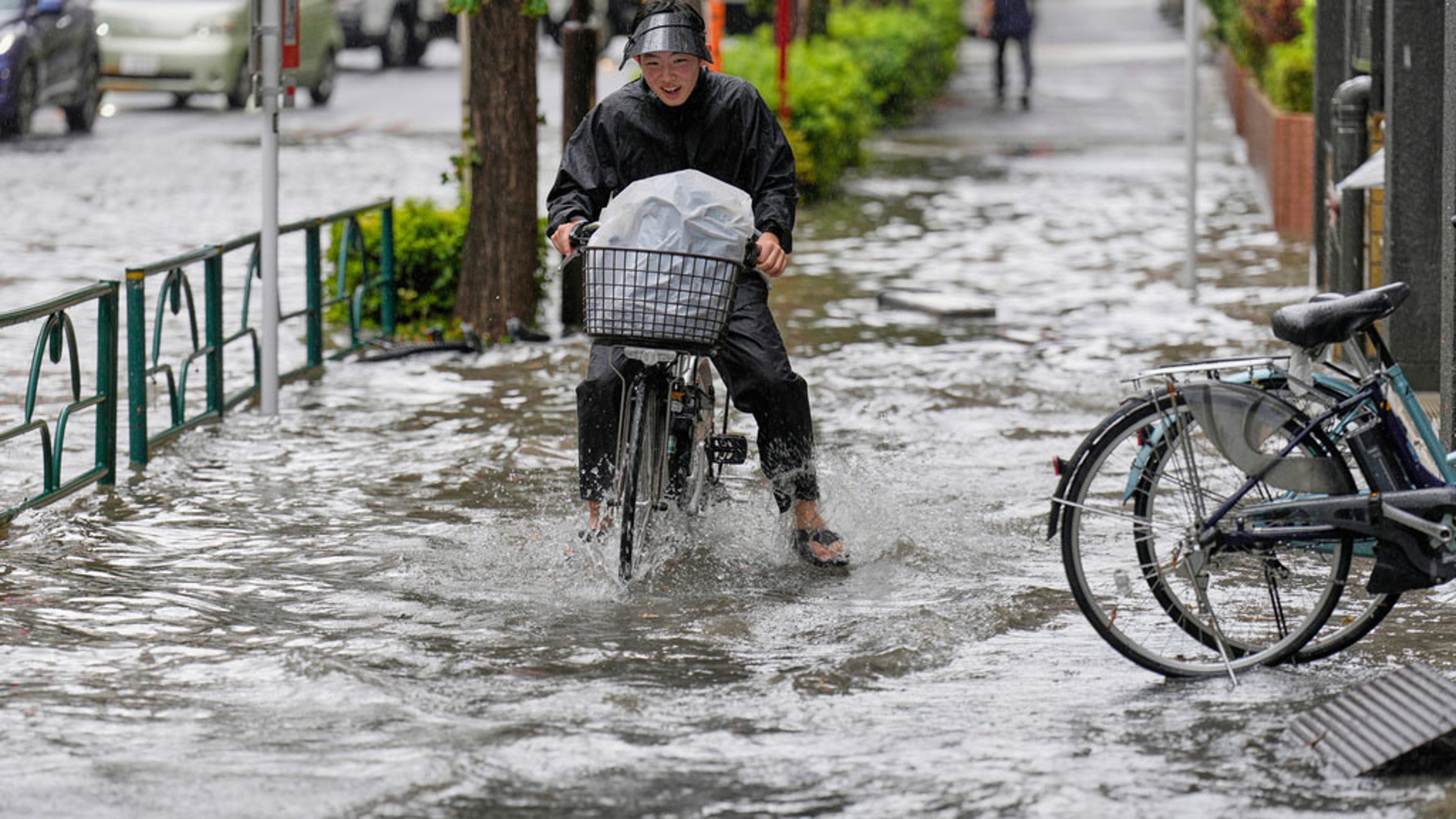 Heavy Rain Swamps Streets Across Tokyo | Weather.com
