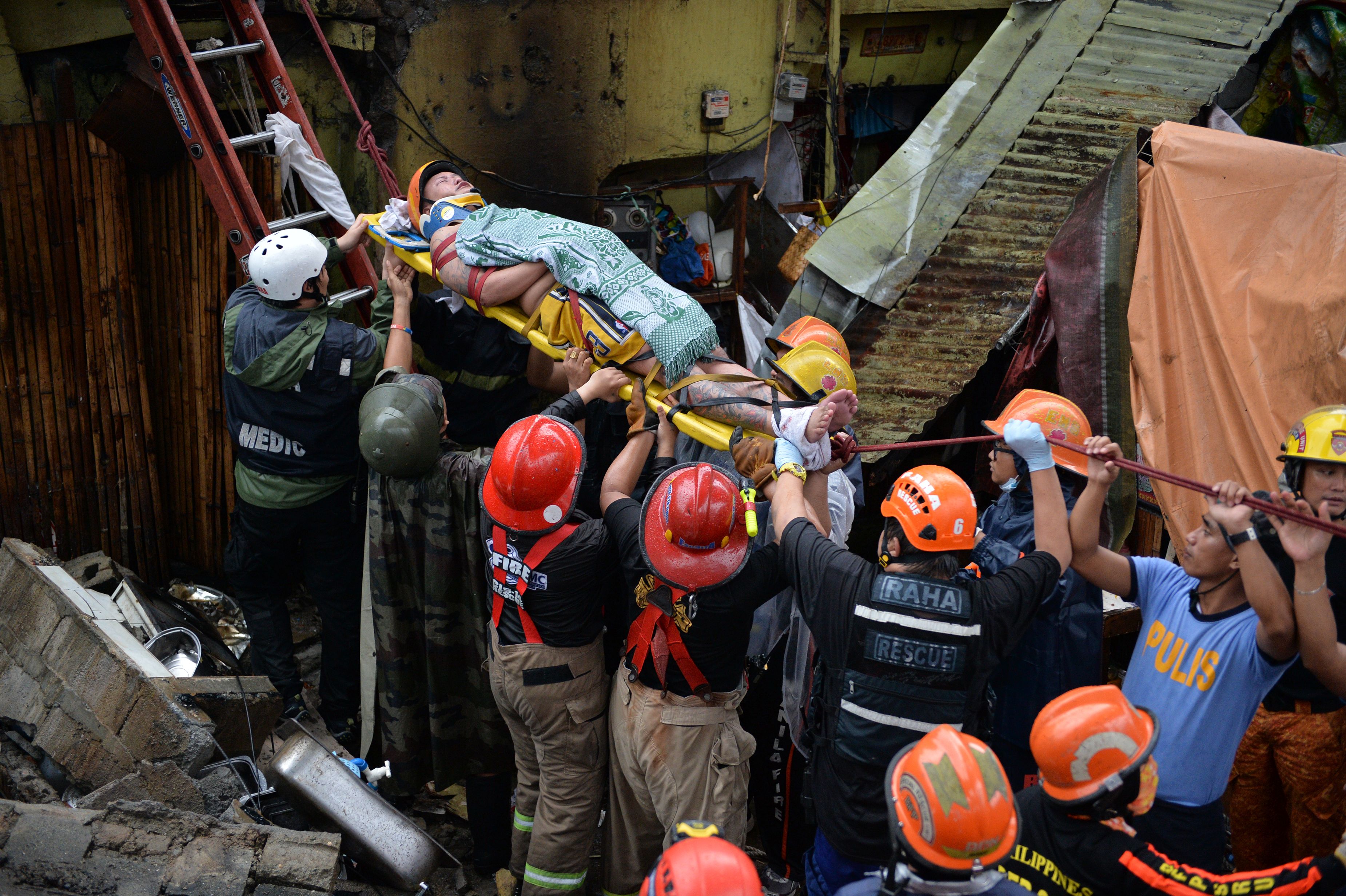 Rescuers Save Man's Life Amid Collapsed Buildings as Heavy Rains and ...