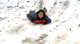 Reporter Sleds Face-First Into Giant Snowman (VIDEO) | The Weather Channel