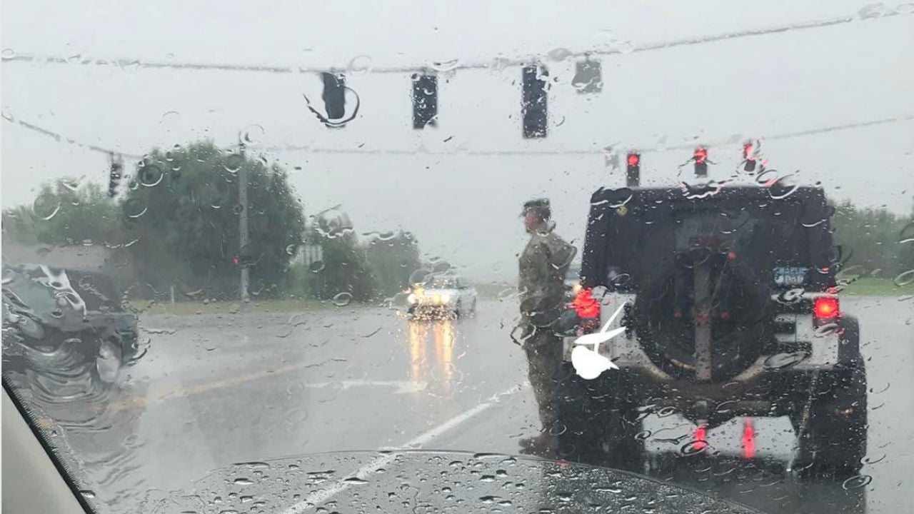 Soldier Pays His Respect Despite Pouring Rain | The Weather Channel
