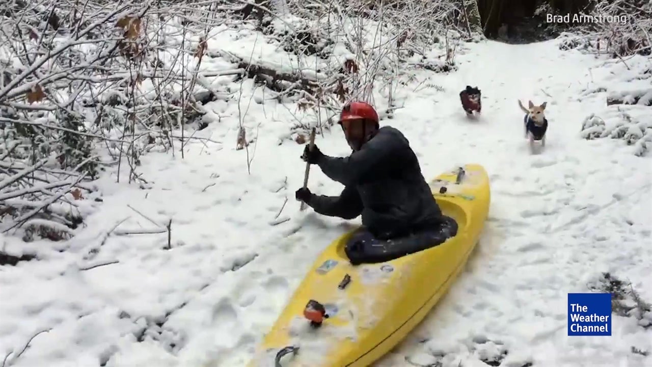 Man Zooms on Kayak Through Snow | The Weather Channel