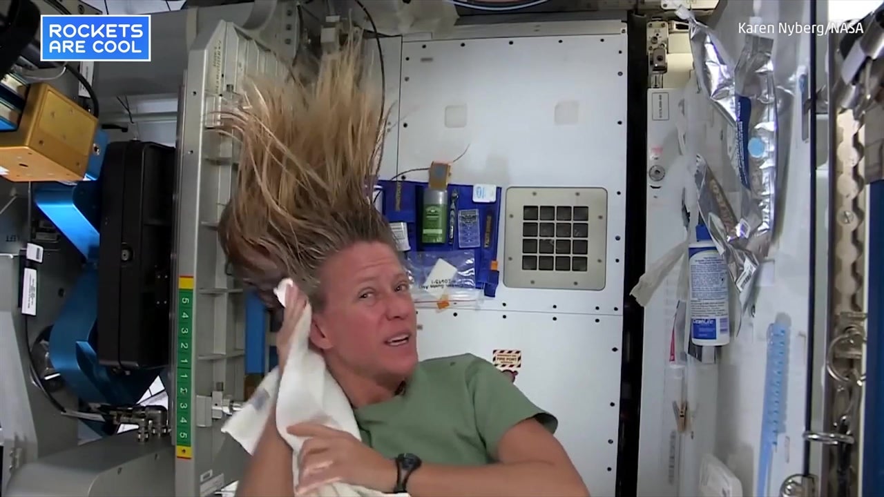 Astronaut Washing Hair In Space