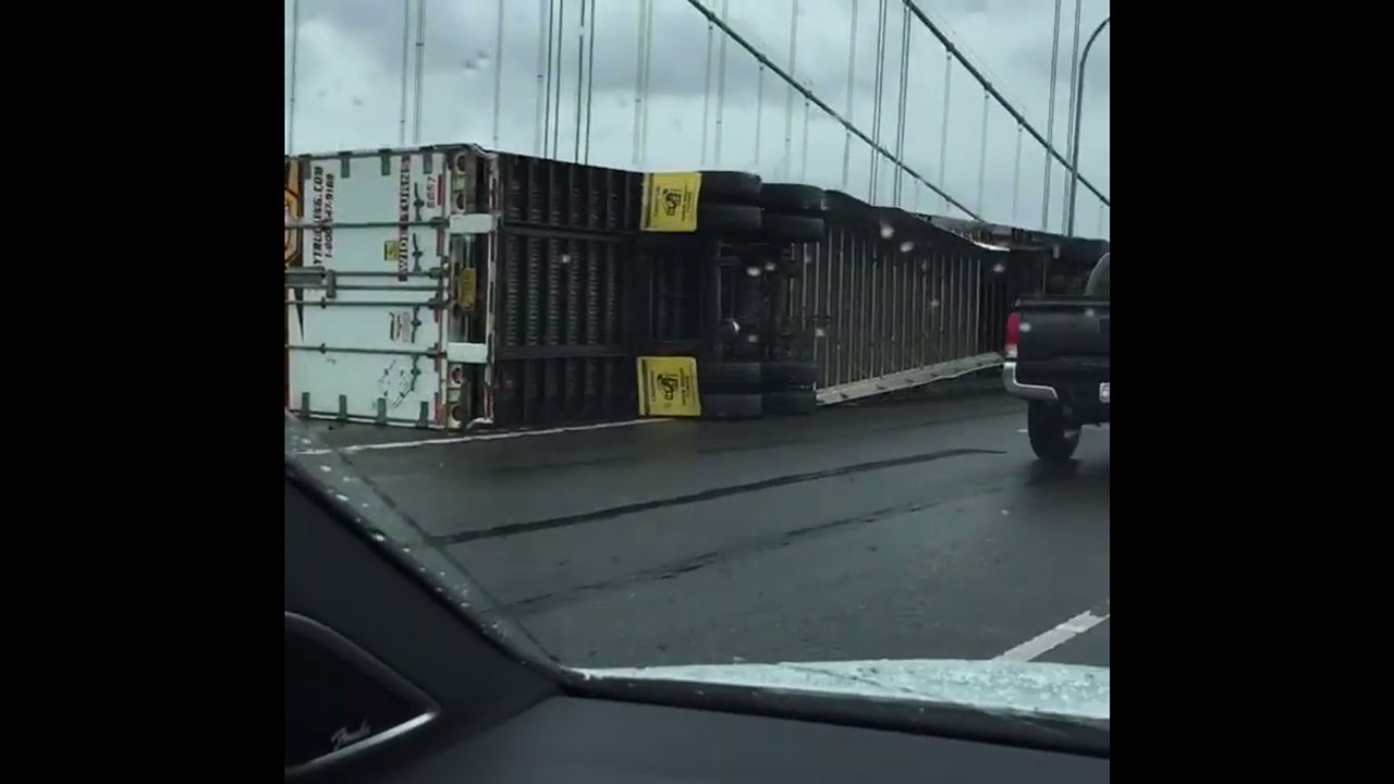 Powerful Winds Blow Over Semi-Trailer on Bridge | The Weather Channel