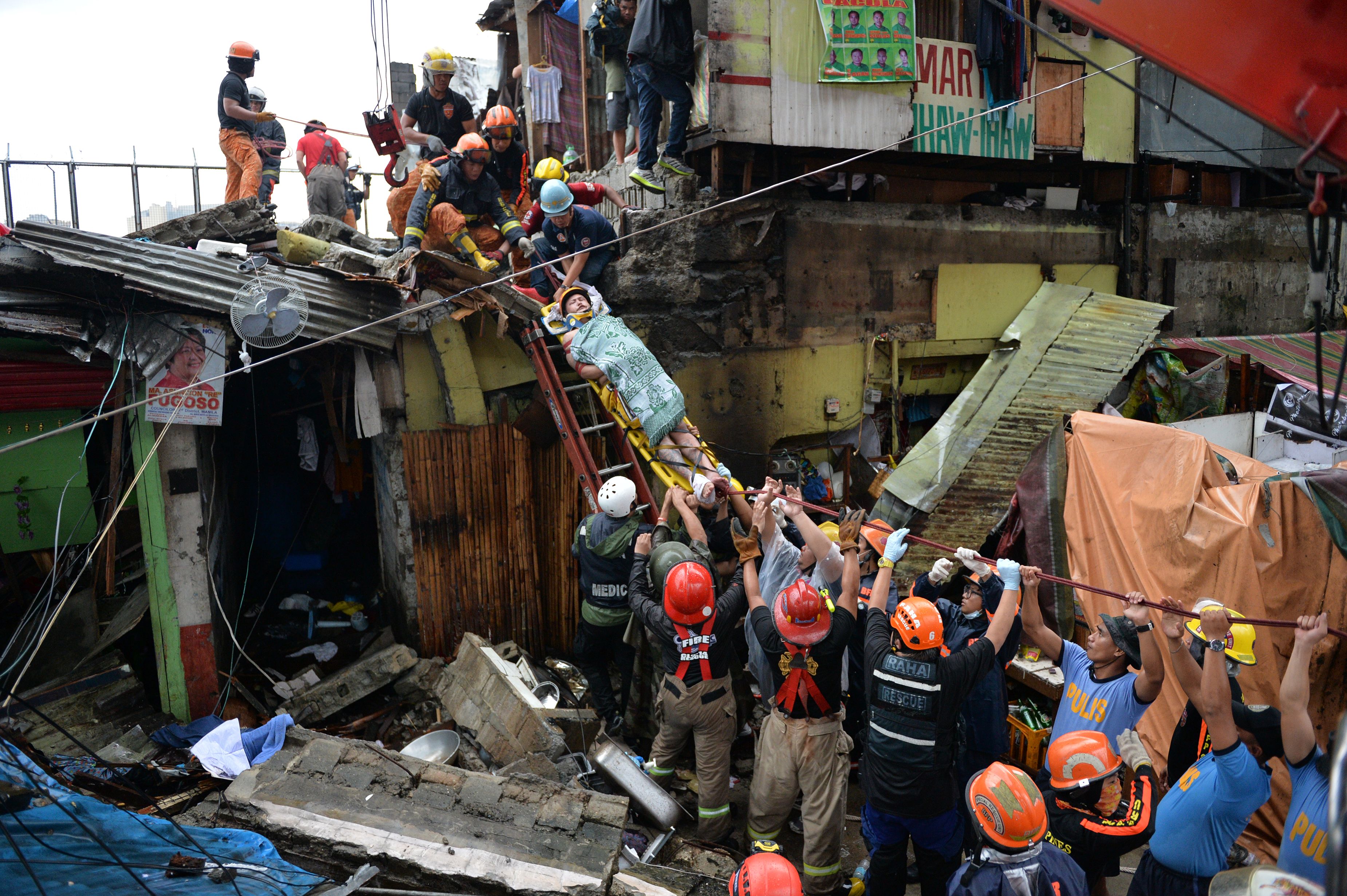 Rescuers Save Man's Life Amid Collapsed Buildings as Heavy Rains and ...